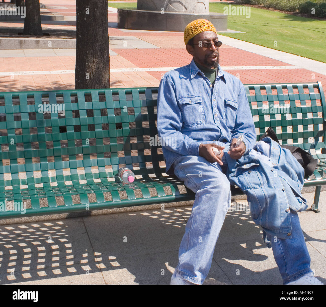 African American man on park bench Stock Photo - Alamy