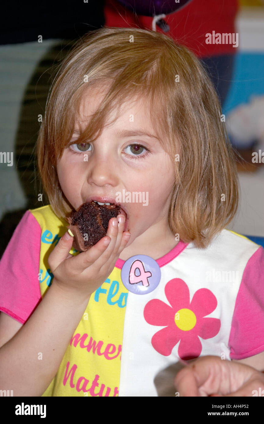 Young girl child Kathryn eating chocolate cake Stock Photo - Alamy