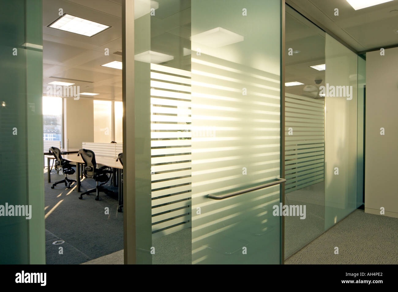 Glass walling partition in modern office Stock Photo - Alamy