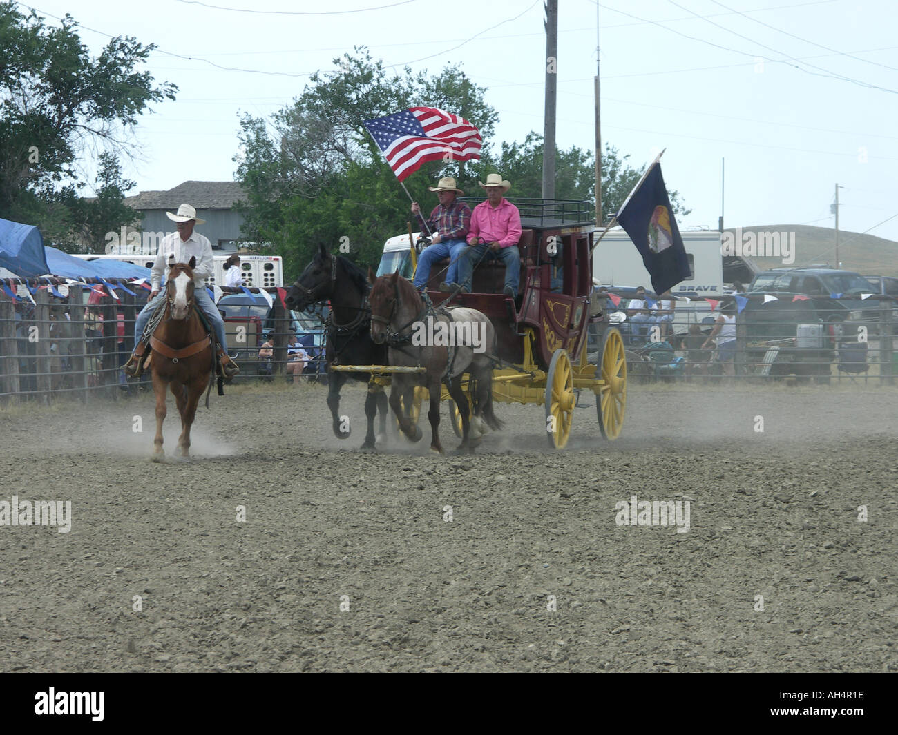 Stagecoach With Cowboys Carrying Flags at Opening of Rodeo Stock Photo ...