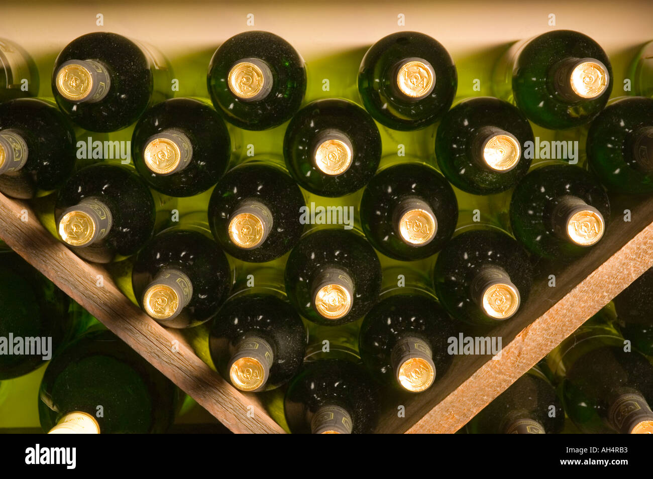Wine bottles stored for aging Stock Photo - Alamy