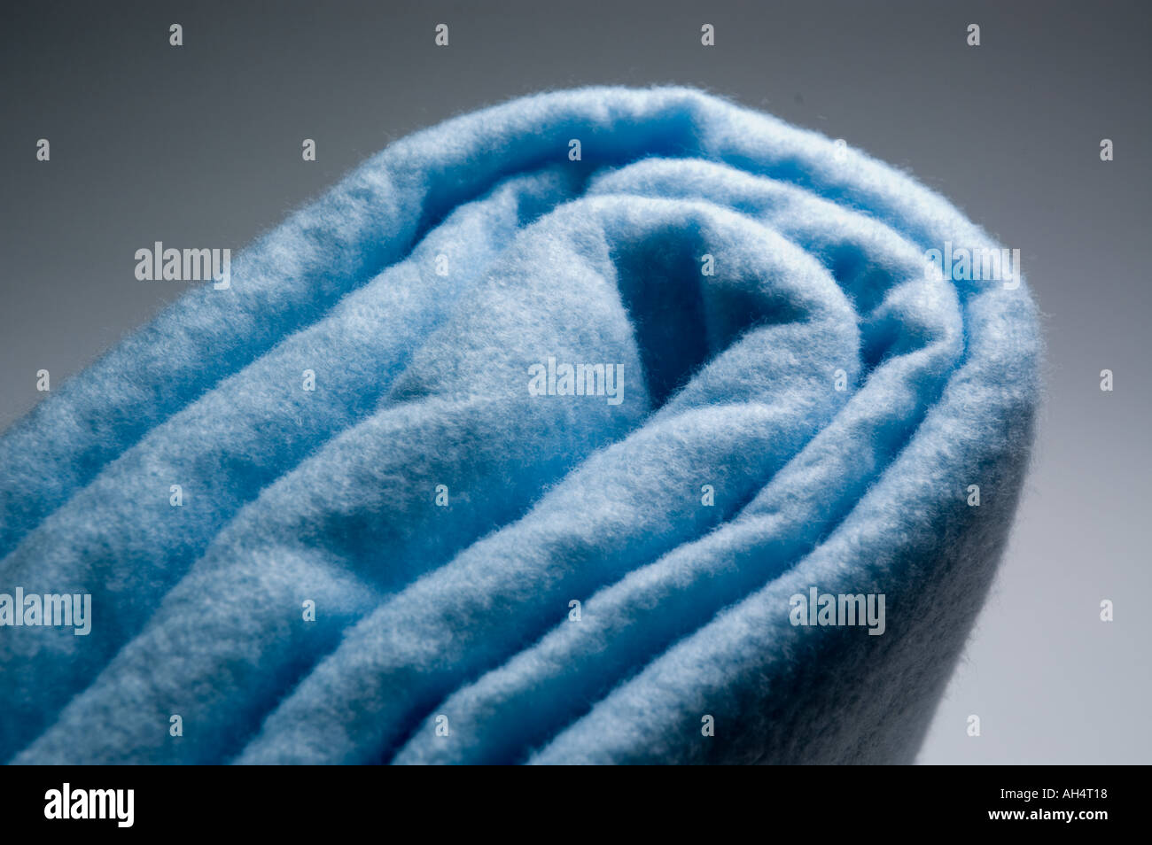 Folded blue blanket Stock Photo - Alamy