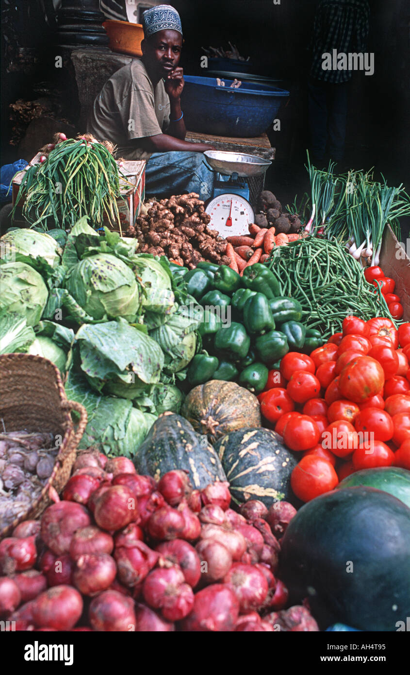 Vendor selling fruit and vegetables at market Stone Town Zanzibar ...