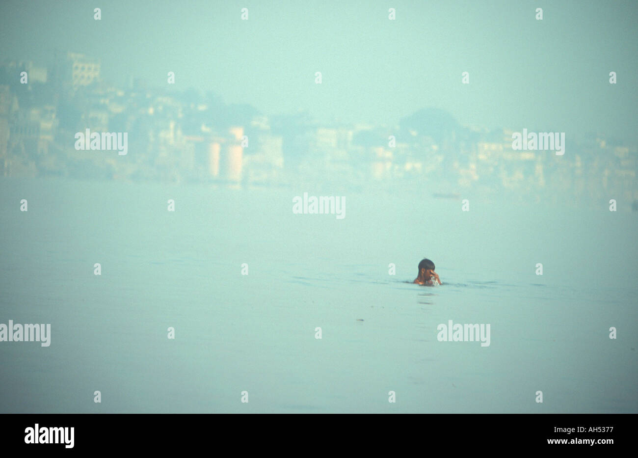 A man swimming in the river Ganges Varanasi India Stock Photo - Alamy