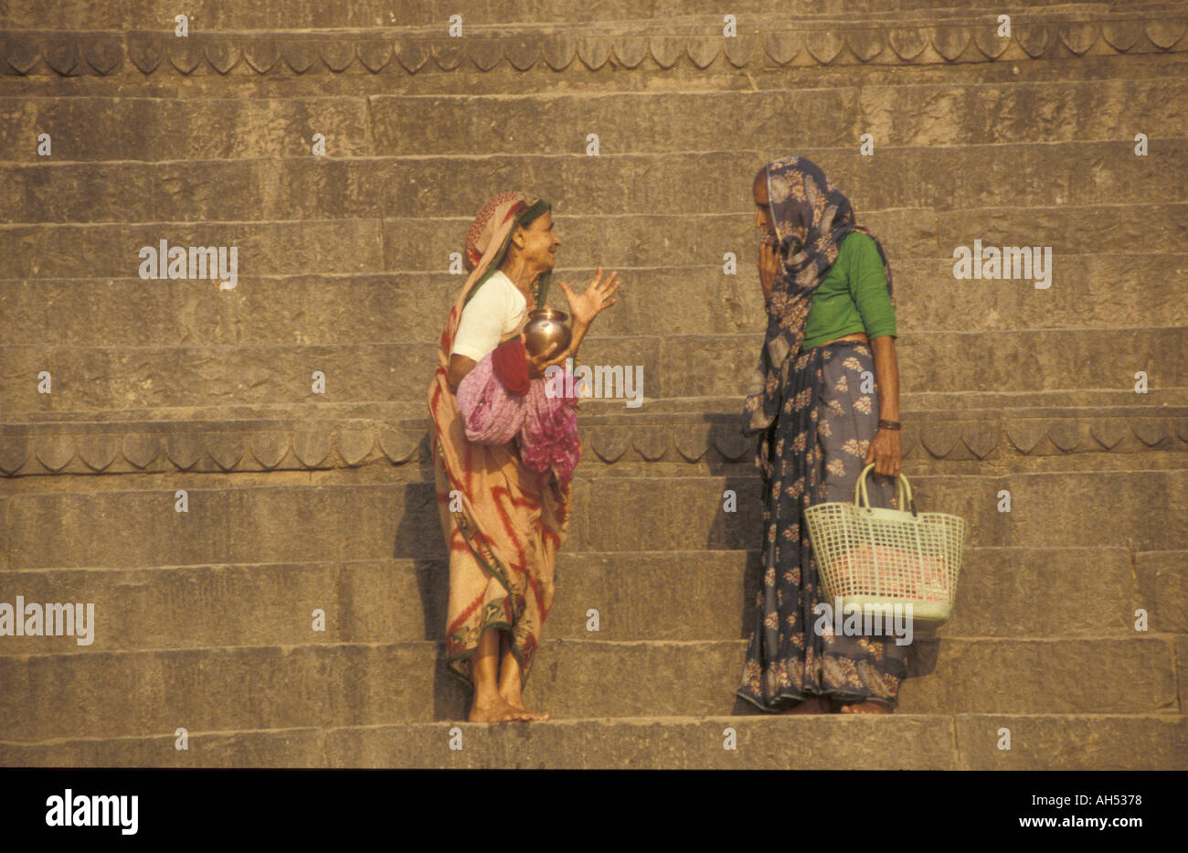 Two women talking at the Ghats Varanasi India Stock Photo - Alamy