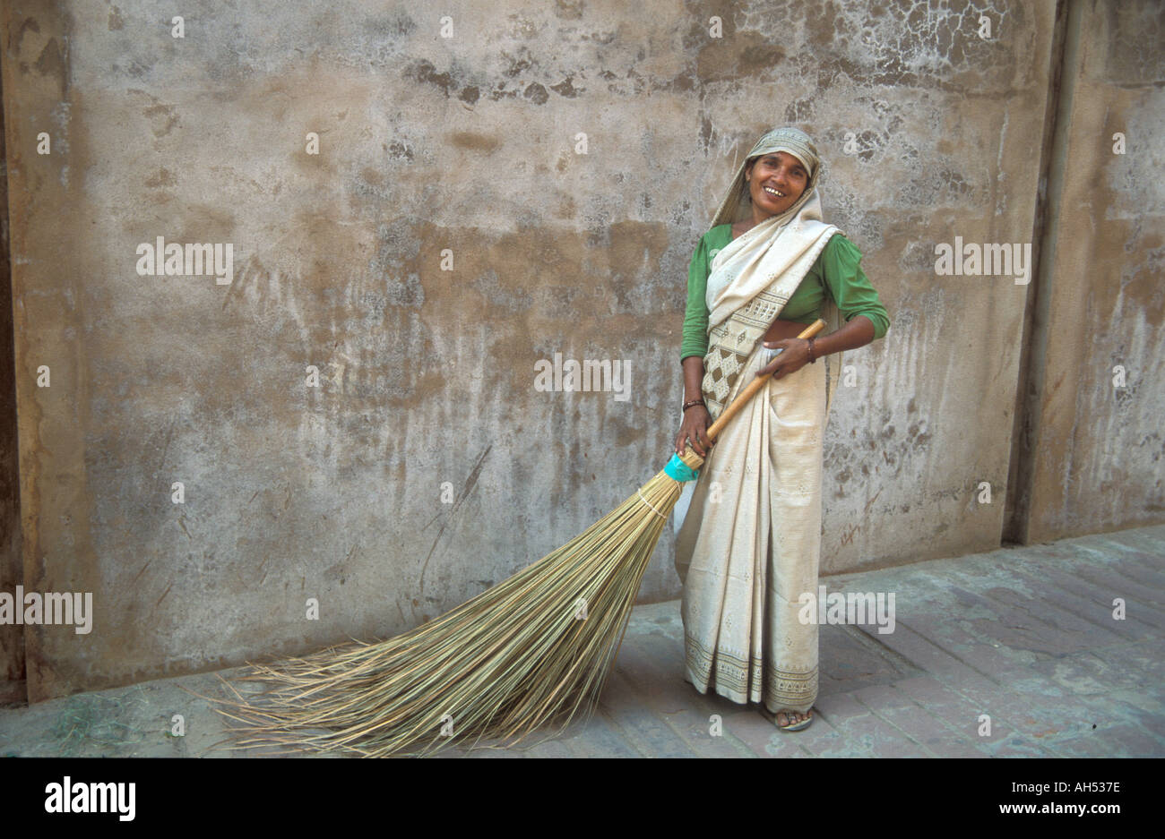 Indian women cleaning street hi-res stock photography and images - Alamy