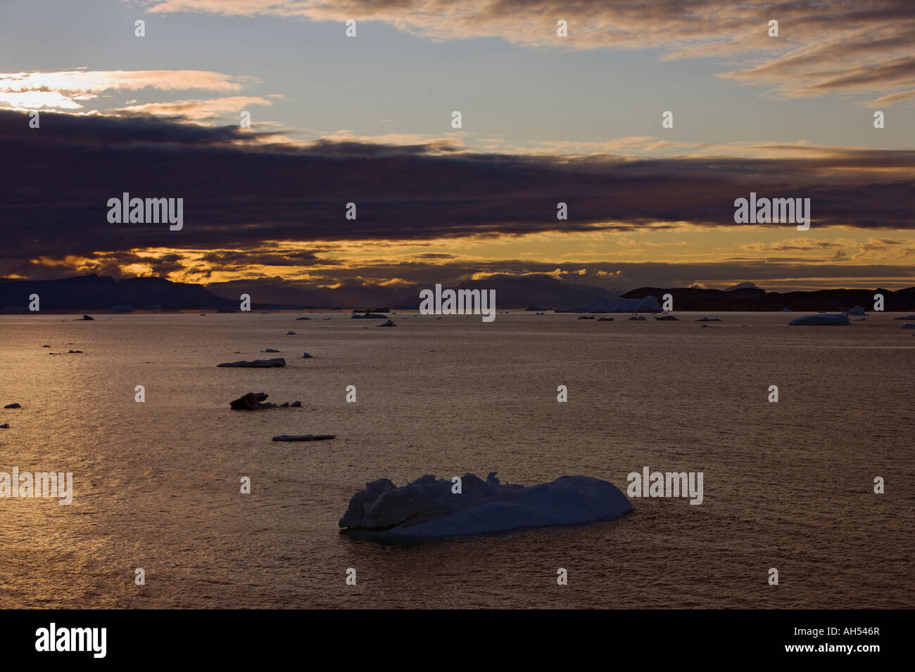 Icebergs on a very calm sea with sunset sky in Disko Bay in the Davis ...