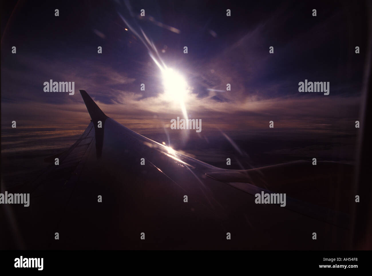 aircraft wing sunset sun lens flare 2143 Stock Photo - Alamy
