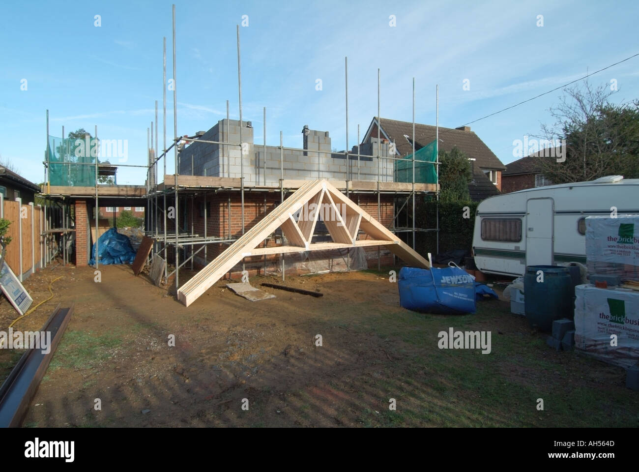 Building materials for new home under construction on infill plot of ...