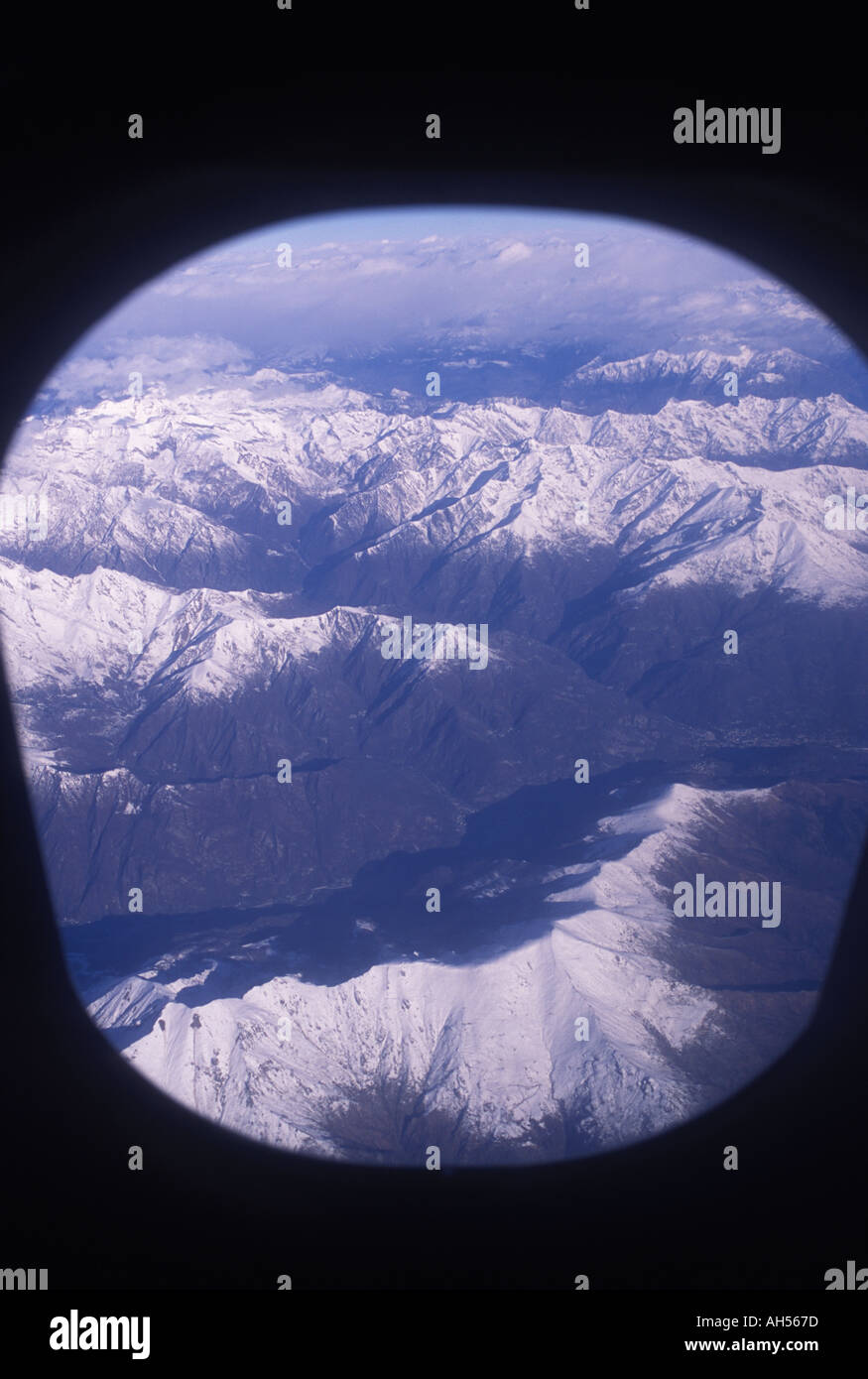 Italian Alps Italy Aerial view of the window of a airplane. HOMER SYKES ...
