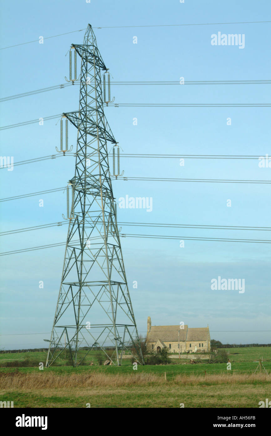 A pylon towers over the Chapel at Shifford Oxfordshire Stock Photo - Alamy