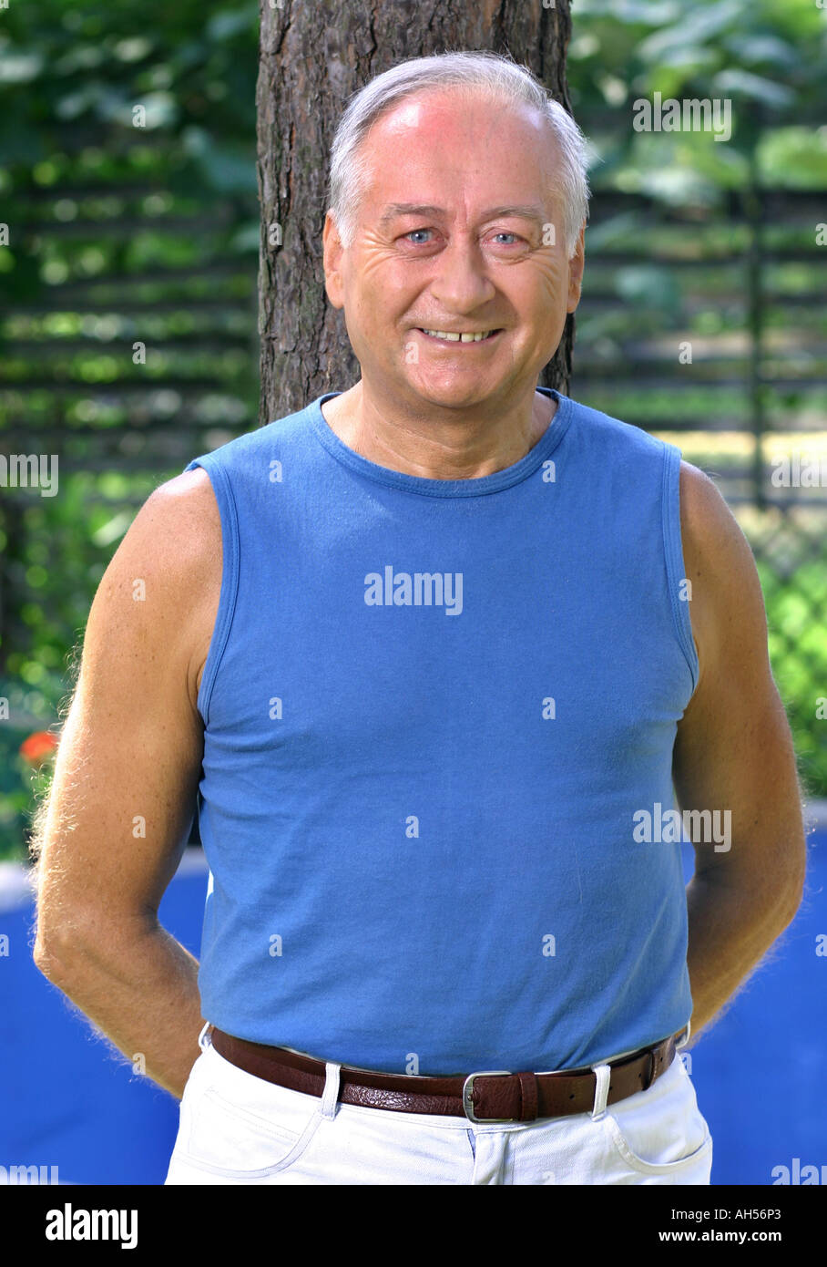 outdoor summer close up day garden tree man 50 55 grey haired smile ...