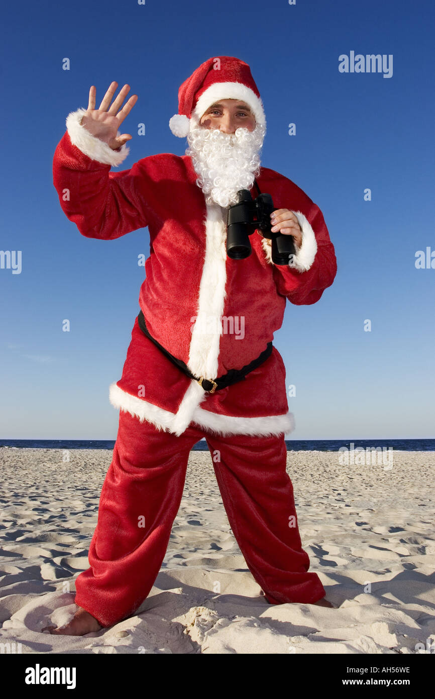 outdoor sand beach summer day water sea dress disguise santa claus cap ...