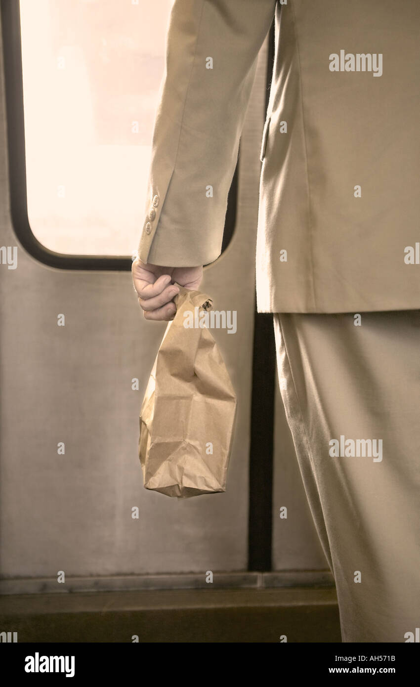Brown Bag Lunch on Commuter Train Stock Photo - Alamy