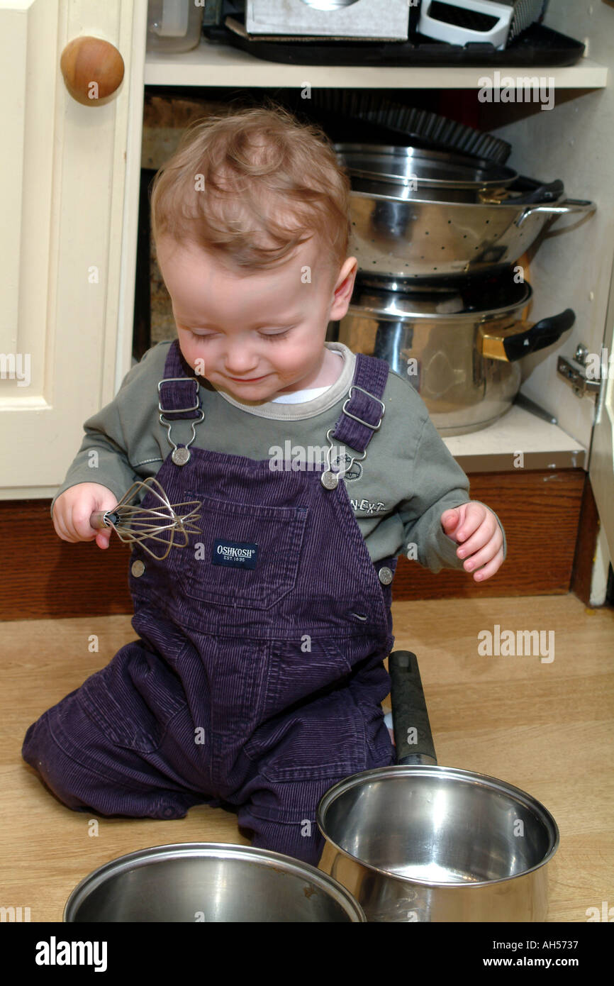 Happy Little Boy Plays With Kitchen Utensils Pots Pans Stock Photo - Alamy