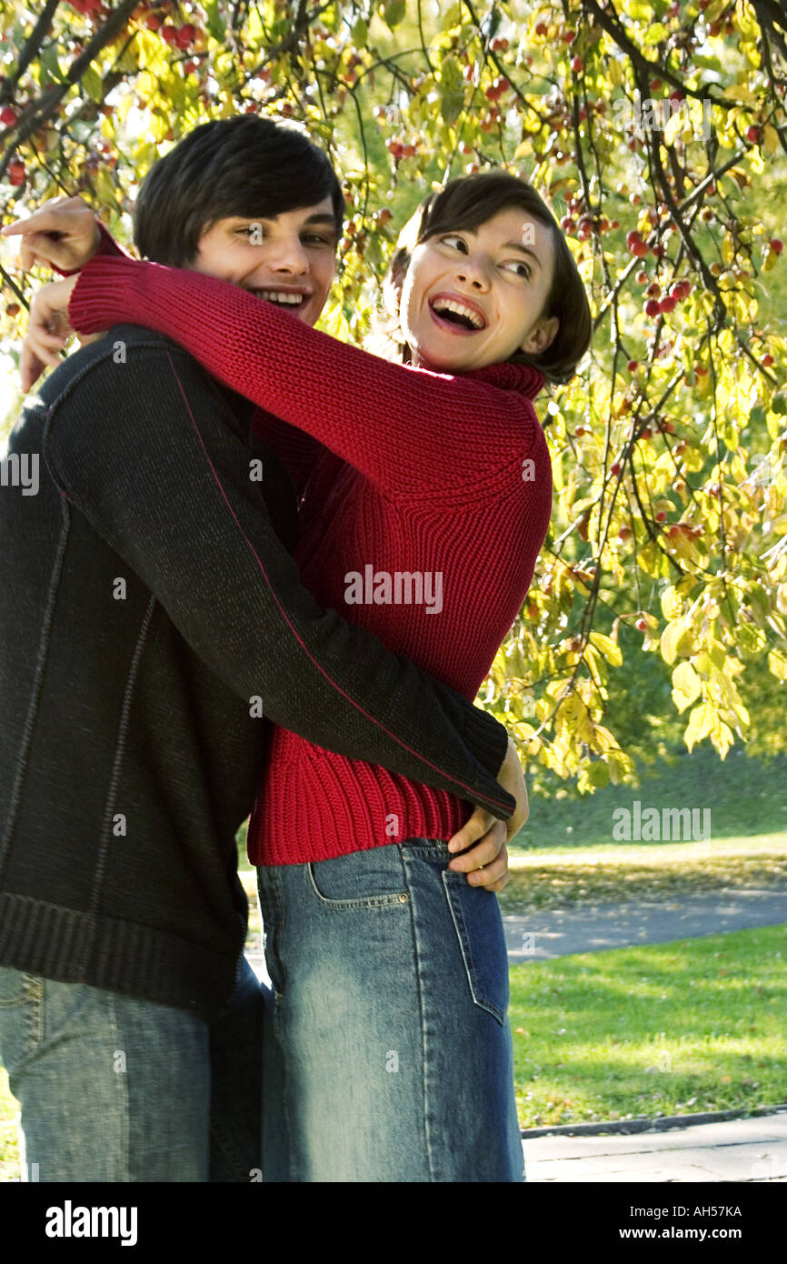 outdoor orchard tree day summer couple girl young woman man boy 20 25 ...