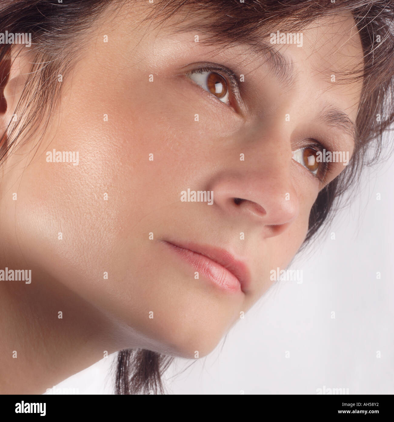 female looking deep in thought Stock Photo - Alamy