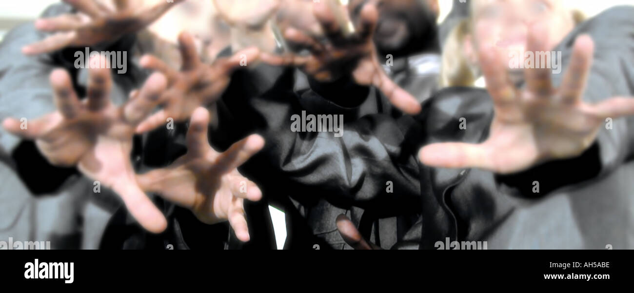 group of mime artists pushing hands towards camera Stock Photo - Alamy