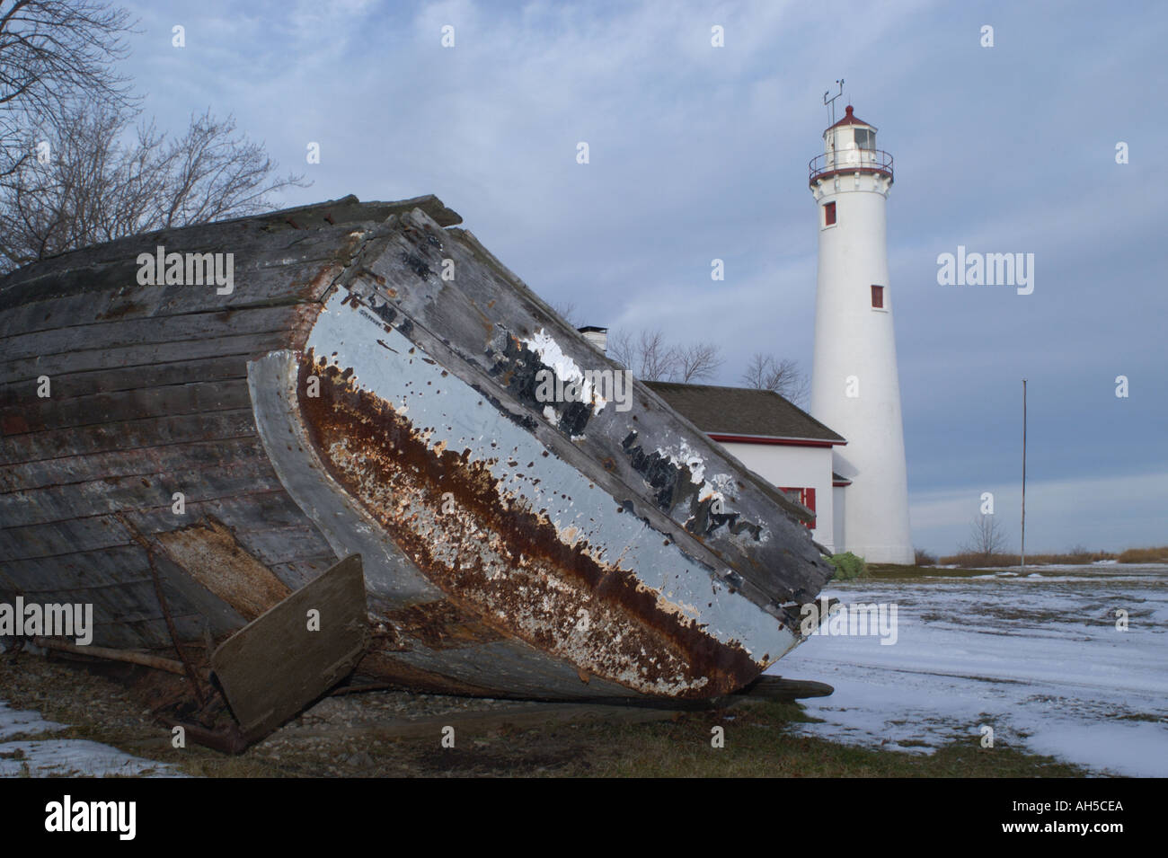 old boat in front of Sturgeon Point Lighthouse in Harrisville Michigan ...