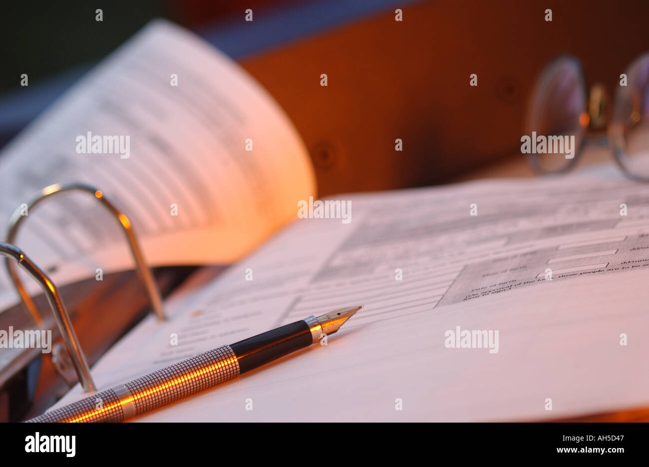 Document in ring binder with pen Stock Photo - Alamy
