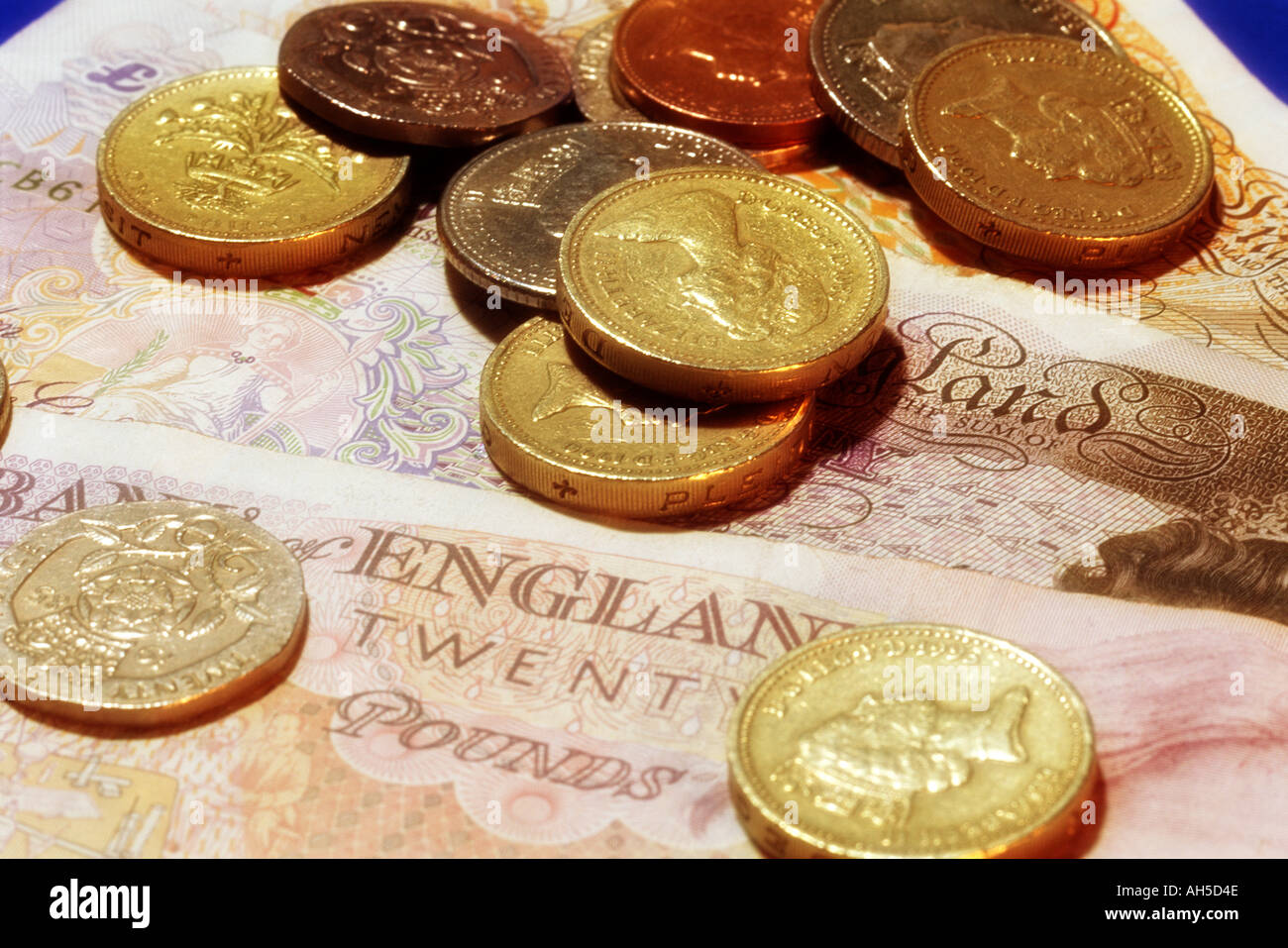 British pound coins on ten pound notes Stock Photo - Alamy