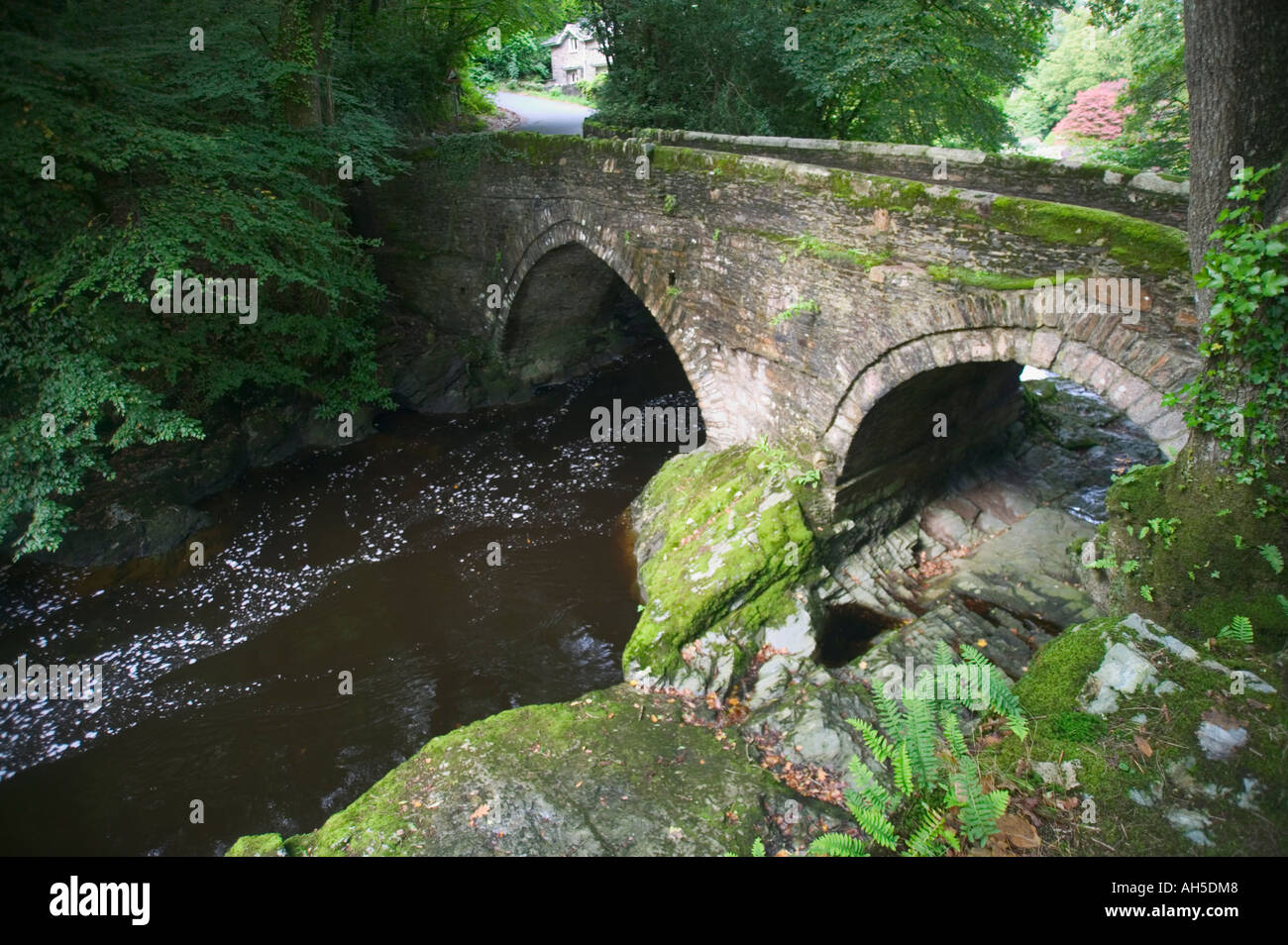 An ancient stone bridge across the River Tavy near Buckland Monachorum ...