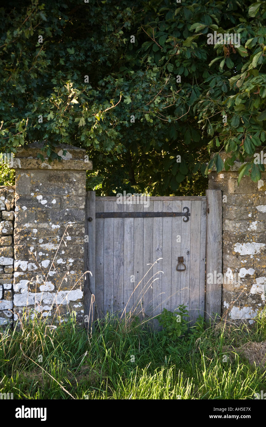 A gate to Misarden Park in the Cotswold village of Miserden ...