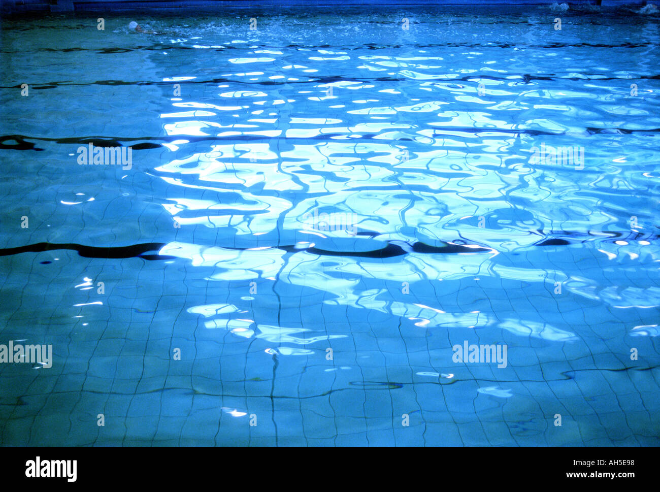 Swimming pool with blue and white reflections Stock Photo - Alamy