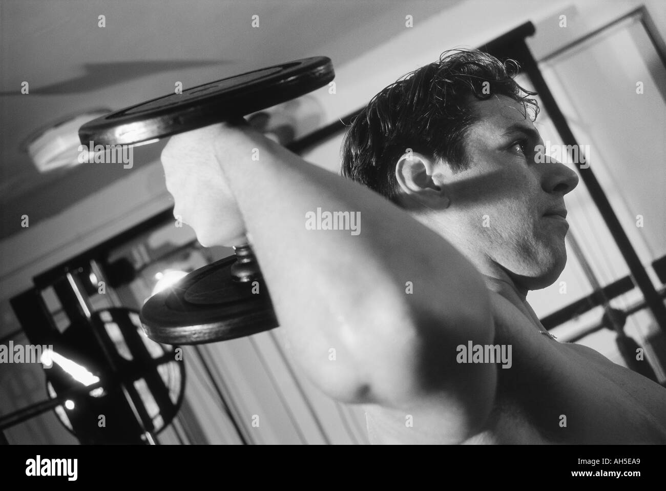 Male using hand weights Stock Photo - Alamy