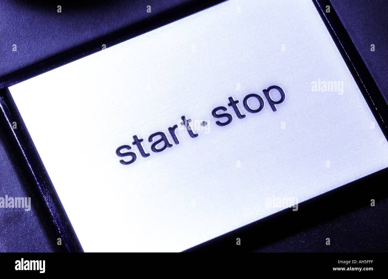 Stop and start button on record deck Stock Photo - Alamy