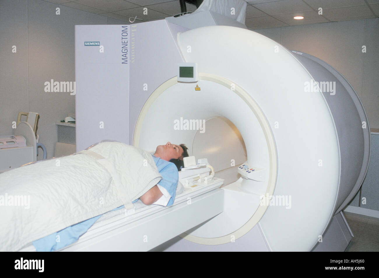 Patient in hospital radiology diagnostic department having a CAT scan ...