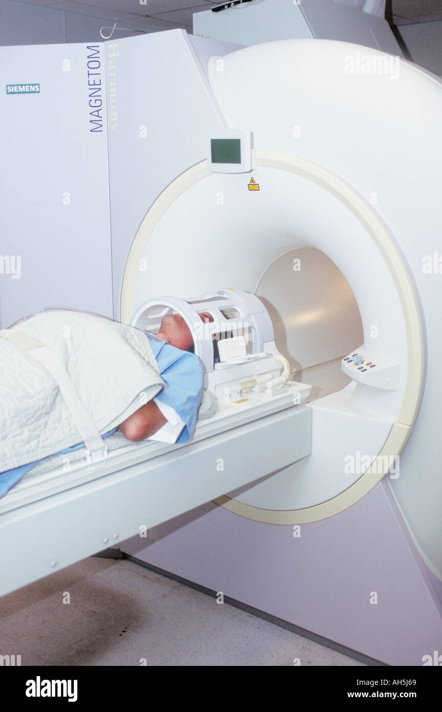 Patient in hospital radiology diagnostic department having a CAT scan ...