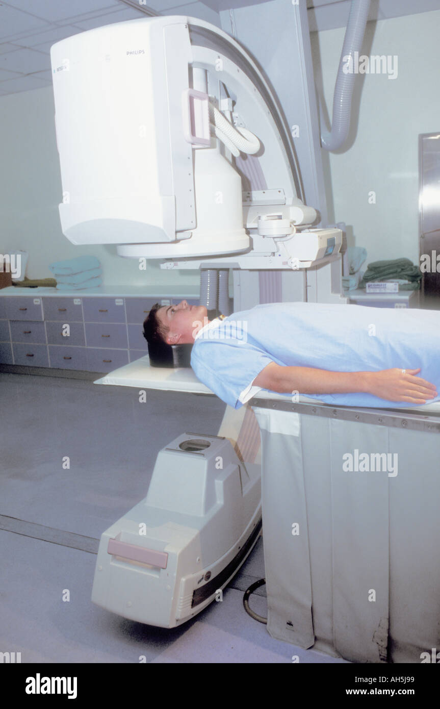 Patient Being X rayed In Hospital With C Arm Fluoroscopy X Ray Machine ...