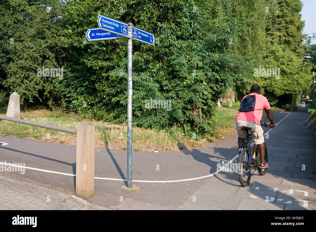 Cyclists using cycle path by the river Thames in Richmond London Stock ...