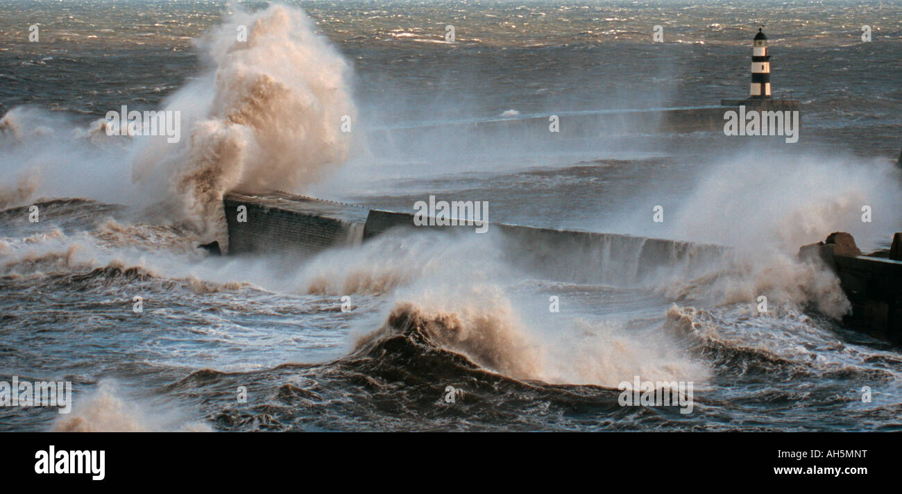 Waves break over the Pier and Lighthouse during a winter storm at ...