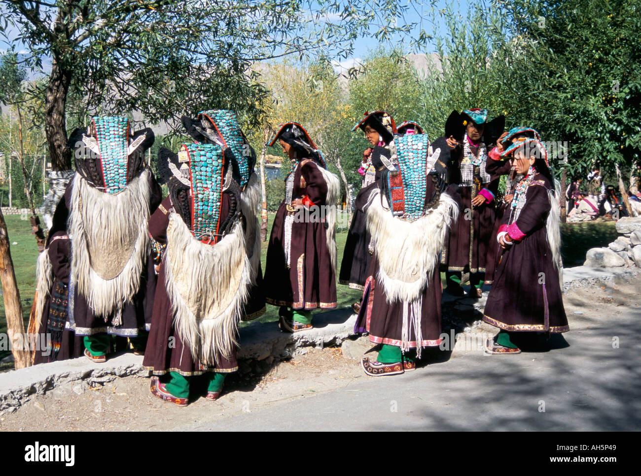 Ladakhi women in traditional clothing yak skin coat and turquoise head ...