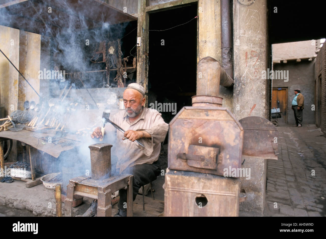 Seated blacksmith hi-res stock photography and images - Alamy