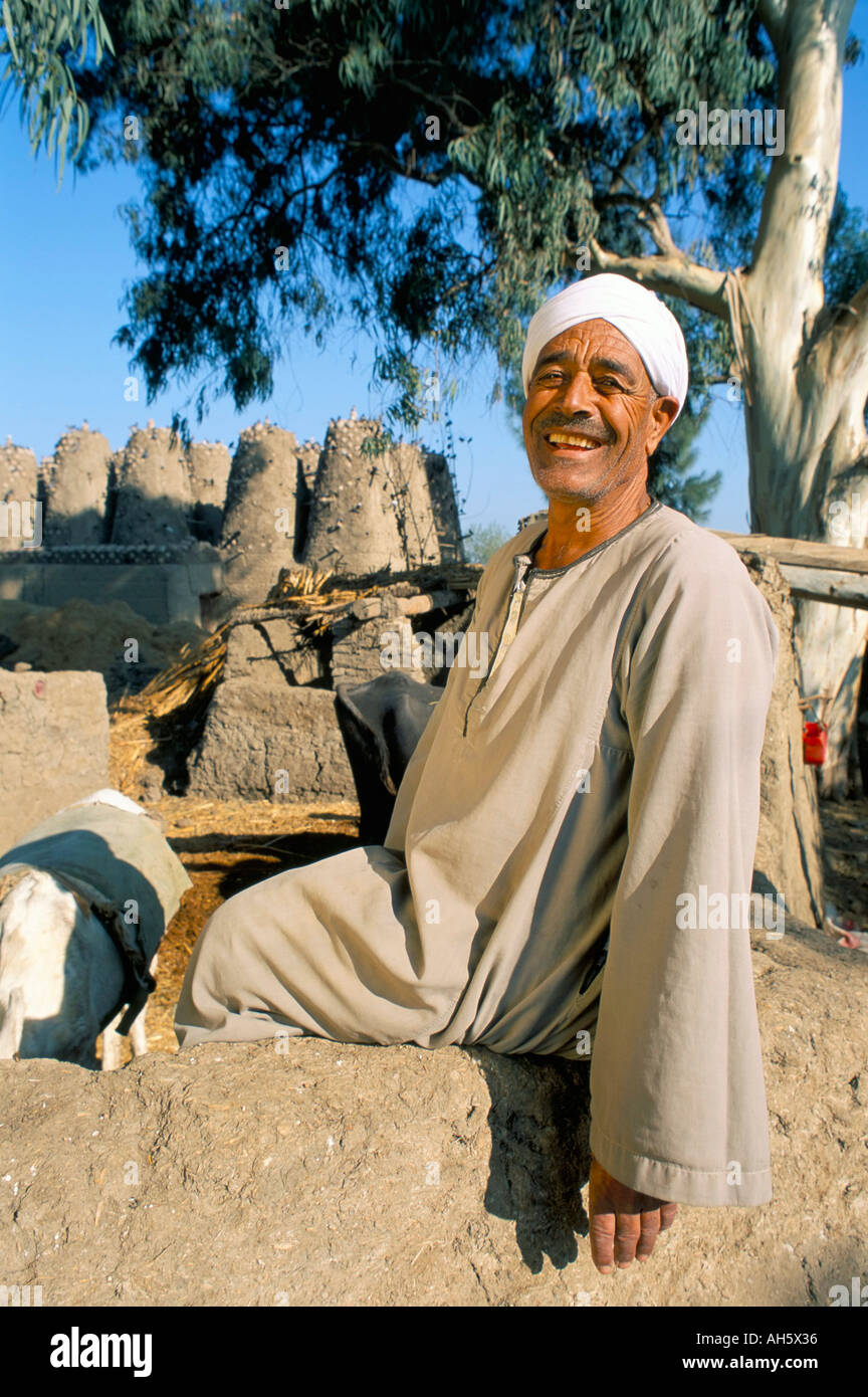 Friendly fellah with dovecotes behind near Tanis Delta area Egypt North ...
