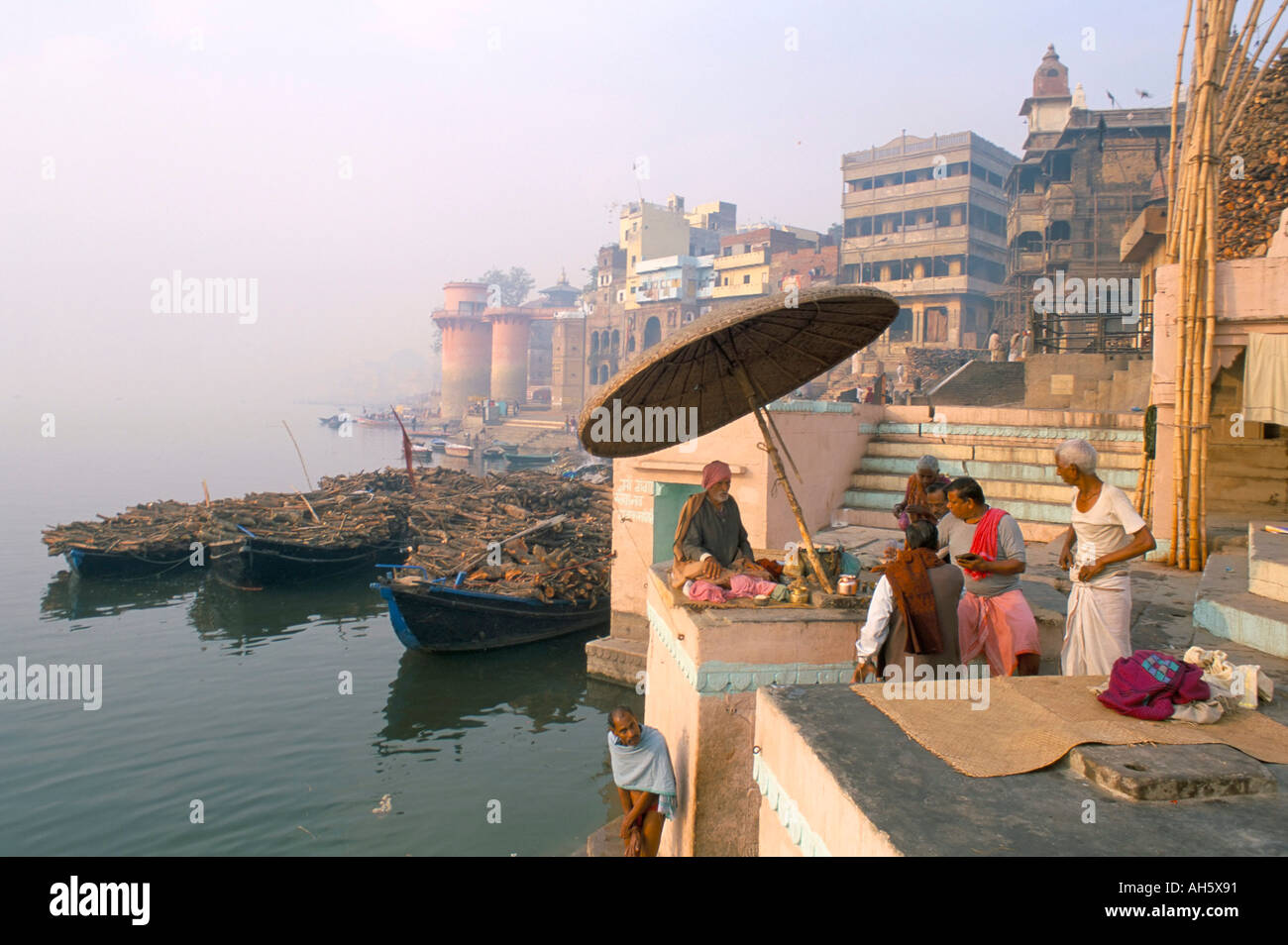 Guru and worshippers at Scindia Ghat Varanasi Benares Uttar Pradesh ...