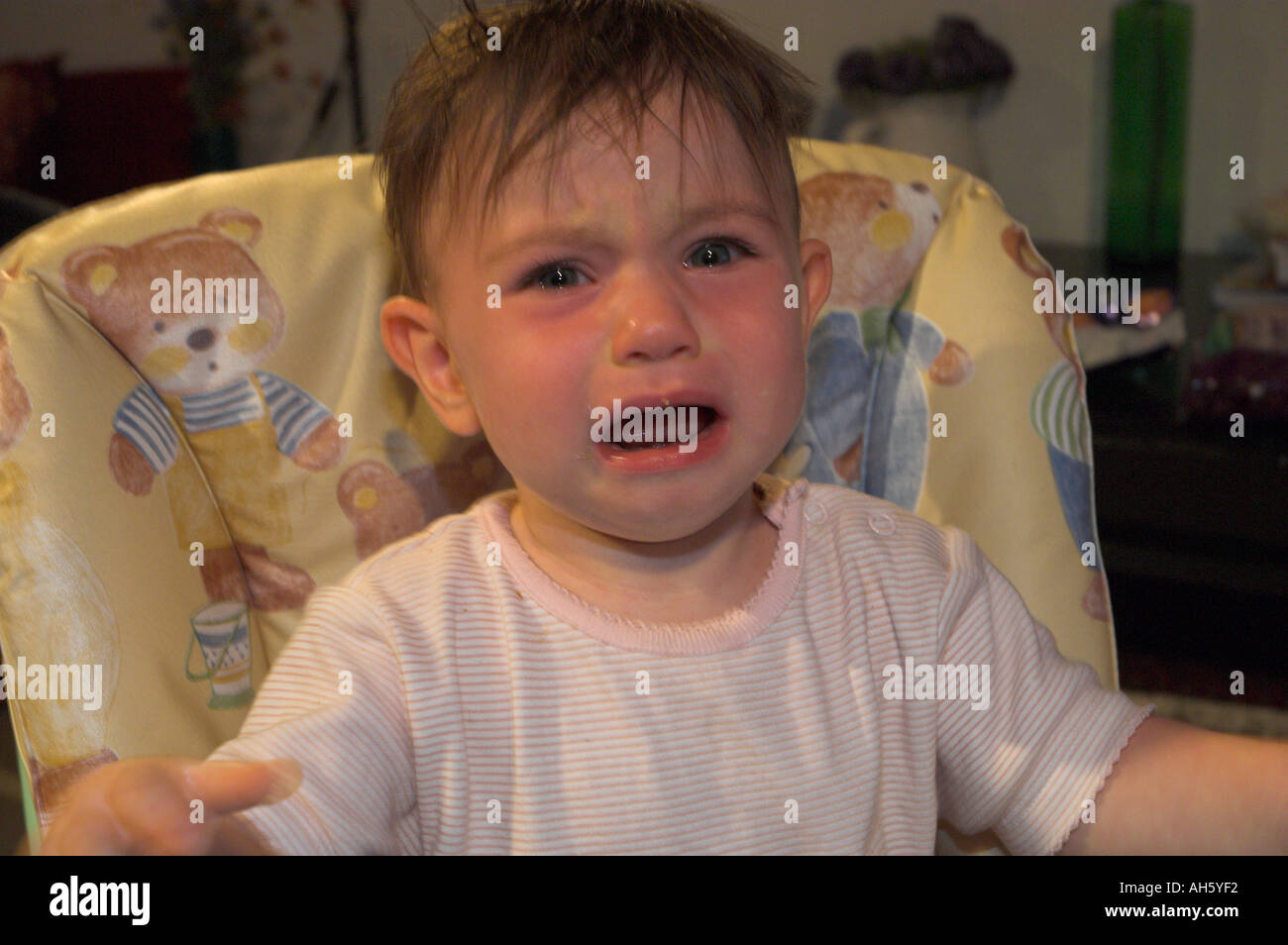 portrait of a baby girl looking and crying with anger Stock Photo - Alamy