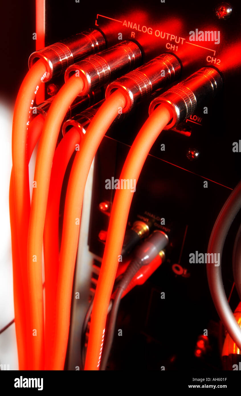 Cables and plugs in red light Stock Photo - Alamy