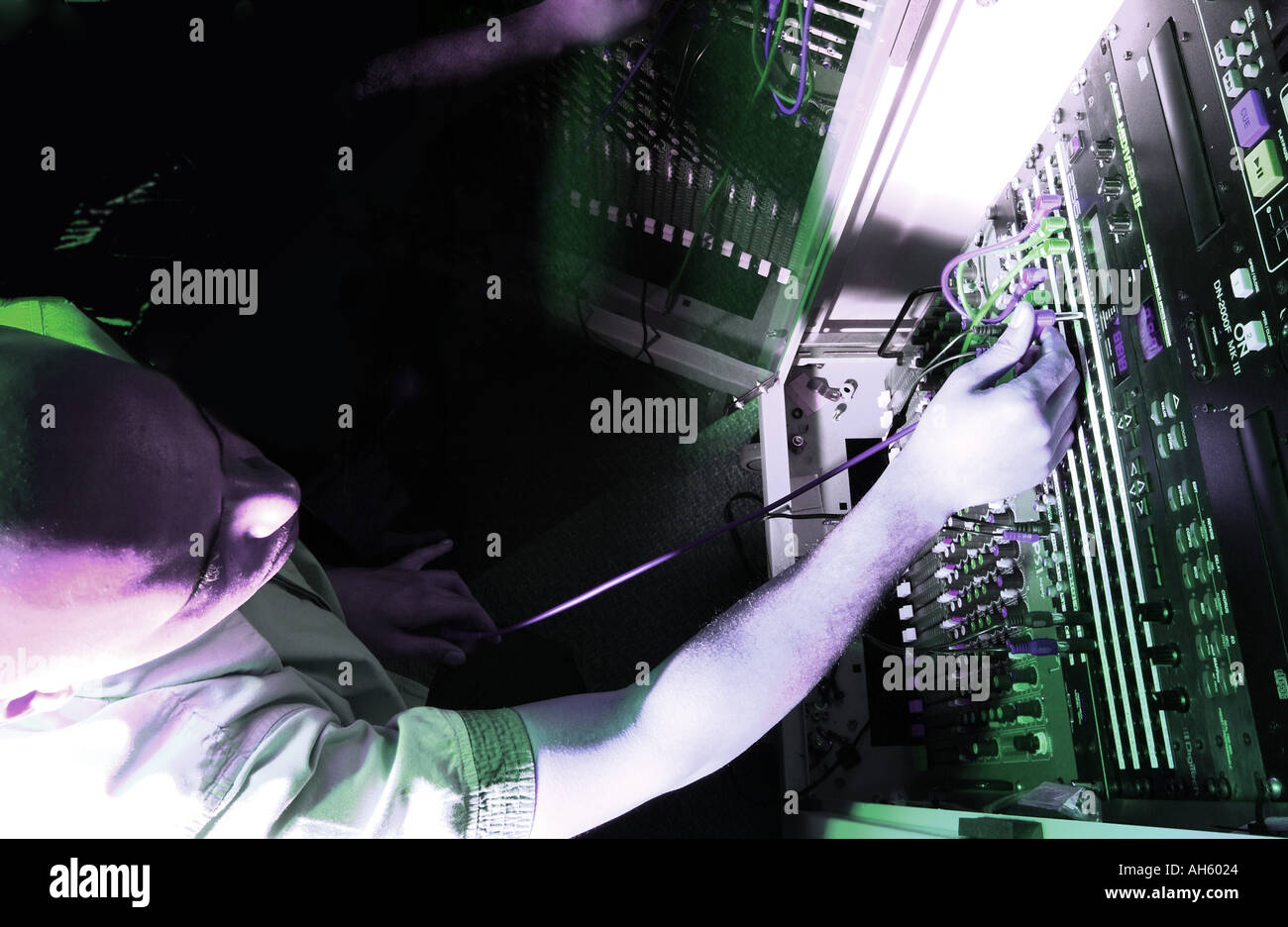 Sound engineer holding cables with console of sound equipment Stock ...