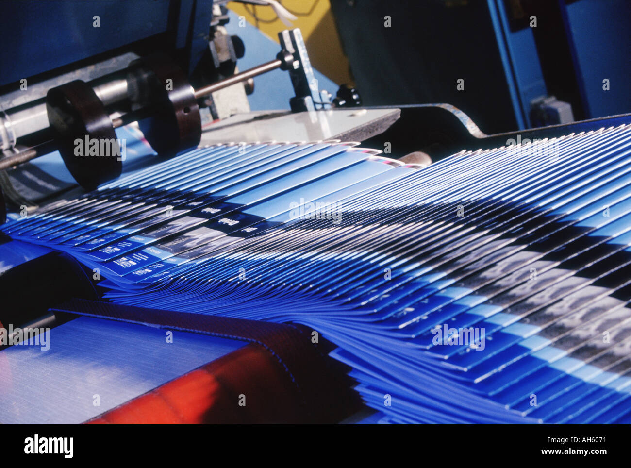 Printing works with machine collating brochures Stock Photo - Alamy
