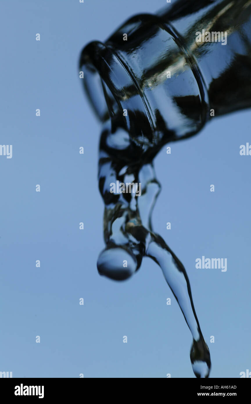 Water coming out of a bottle Stock Photo - Alamy