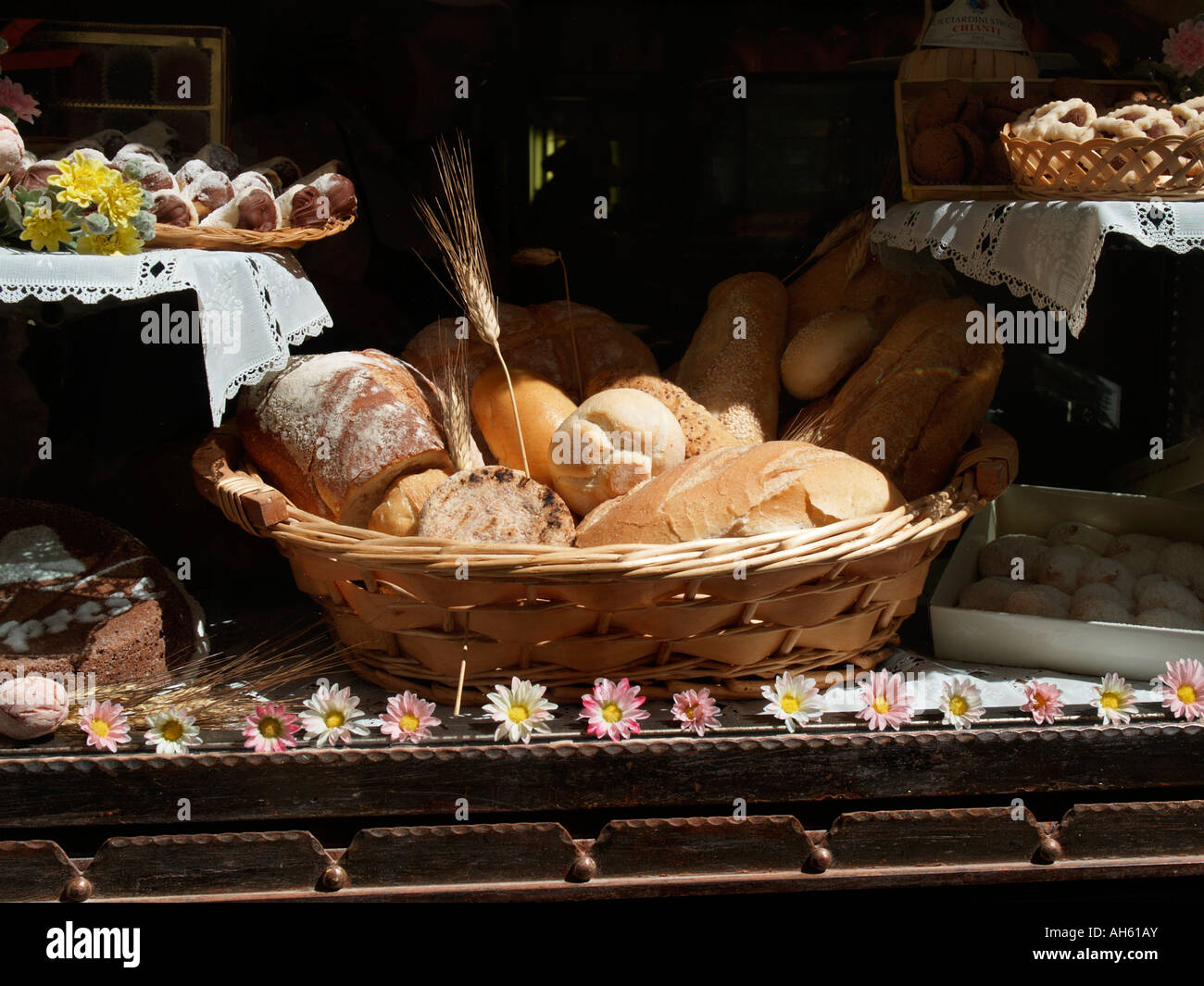 freshly baked bread in basket on display in bakers shop window Capri ...