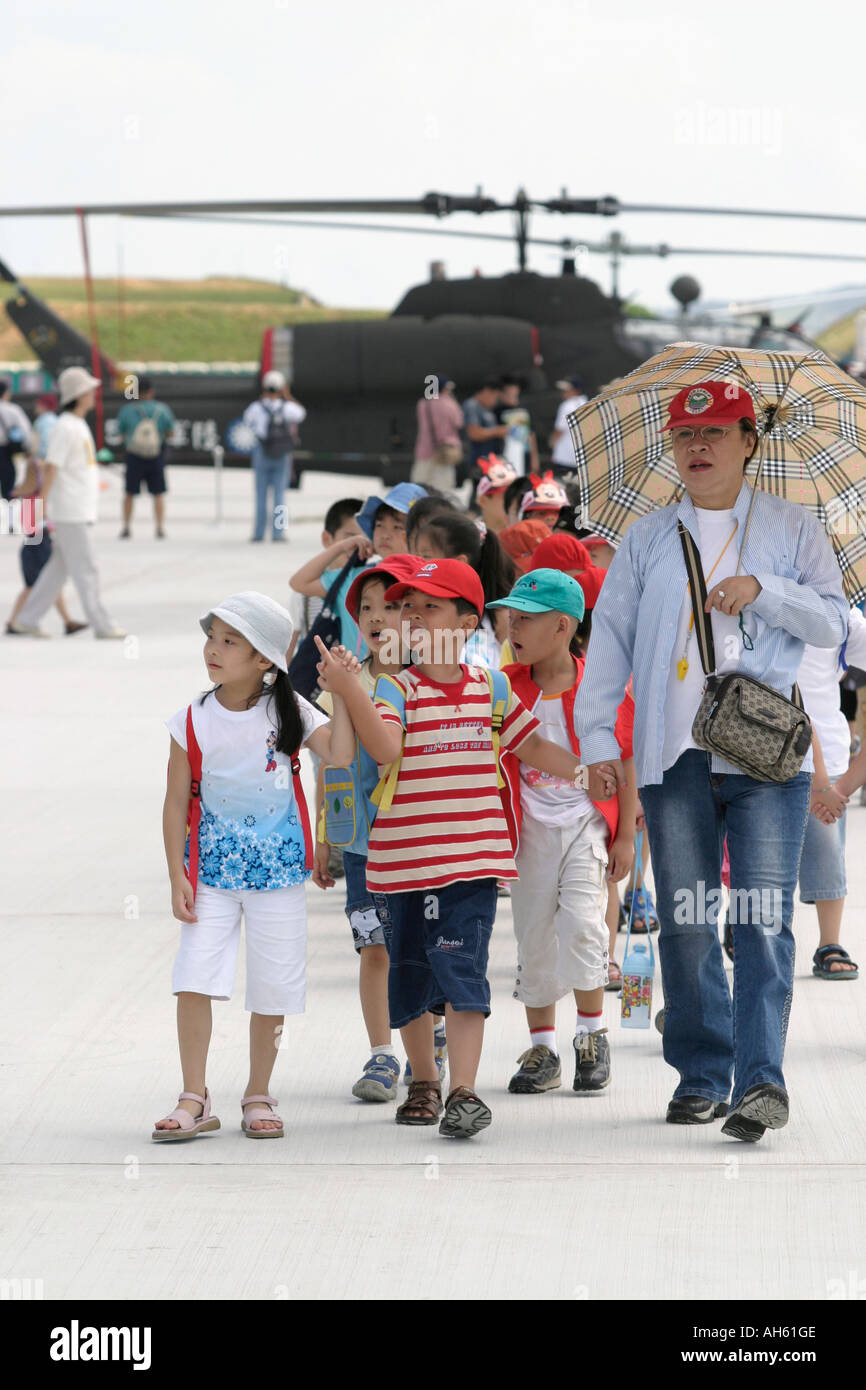 Elementary students visit airplane show Stock Photo - Alamy