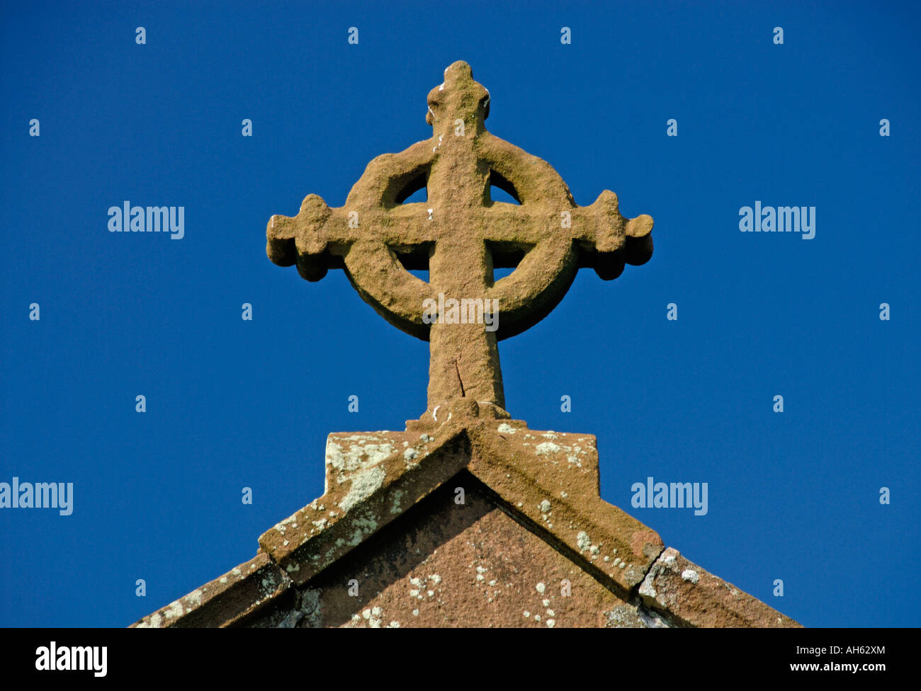 Eroded sandstone cross on East end gable , Church of Saint Cuthbert ...