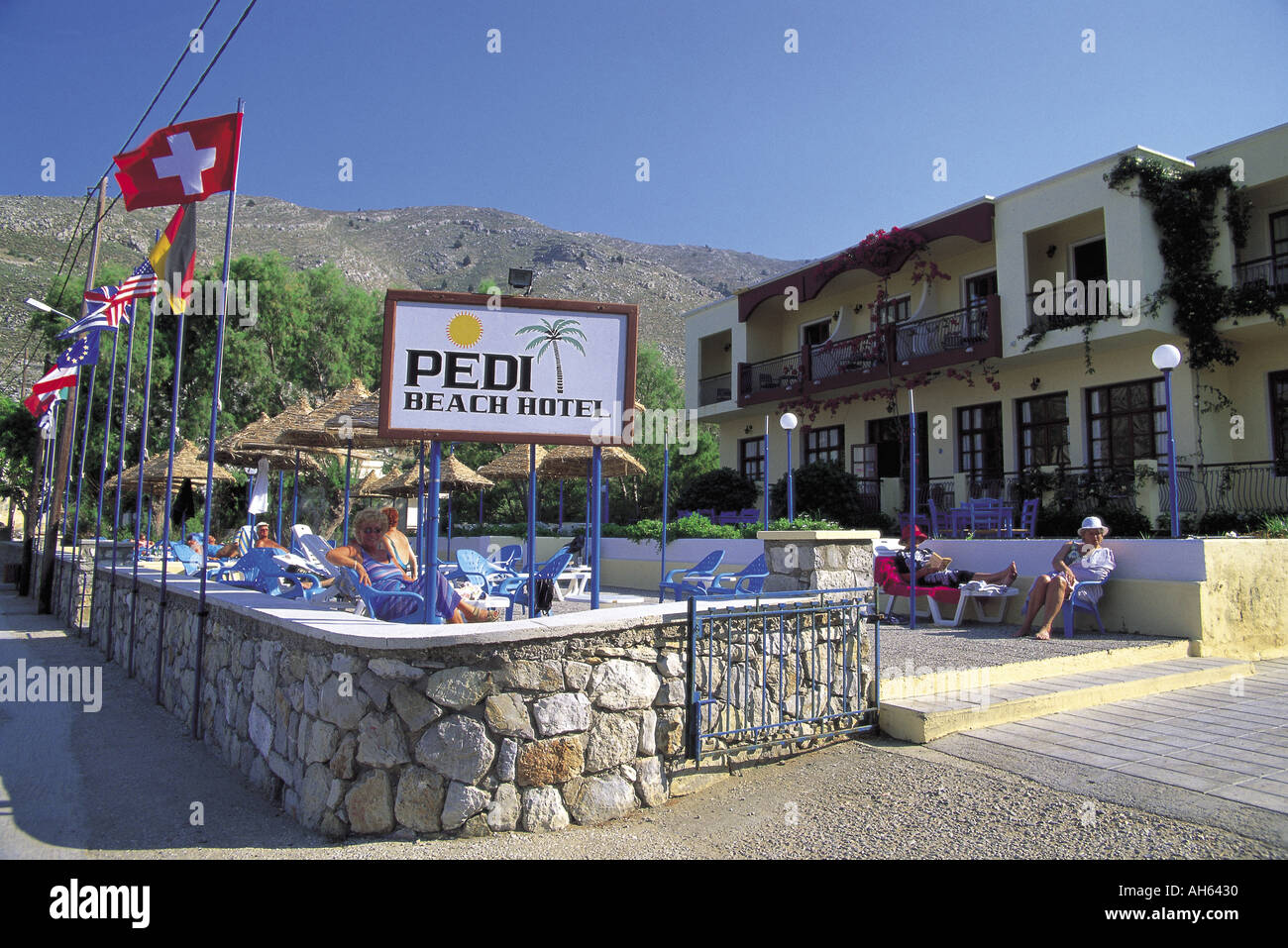 Beach Hotel, Pedi Bay, Symi Island, Greece Stock Photo - Alamy