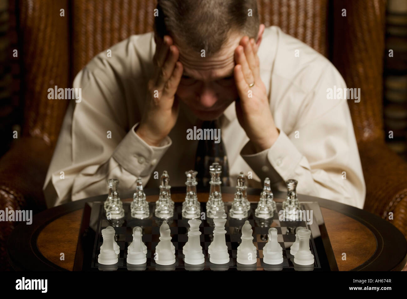 Man concentrating on a chess game Stock Photo - Alamy