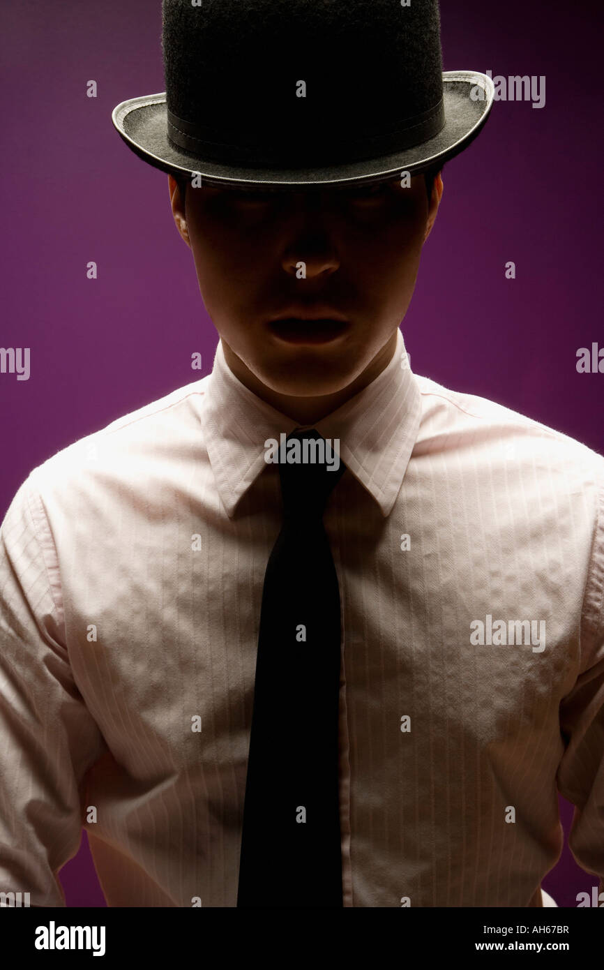 Man's face shadowed by hat Stock Photo - Alamy